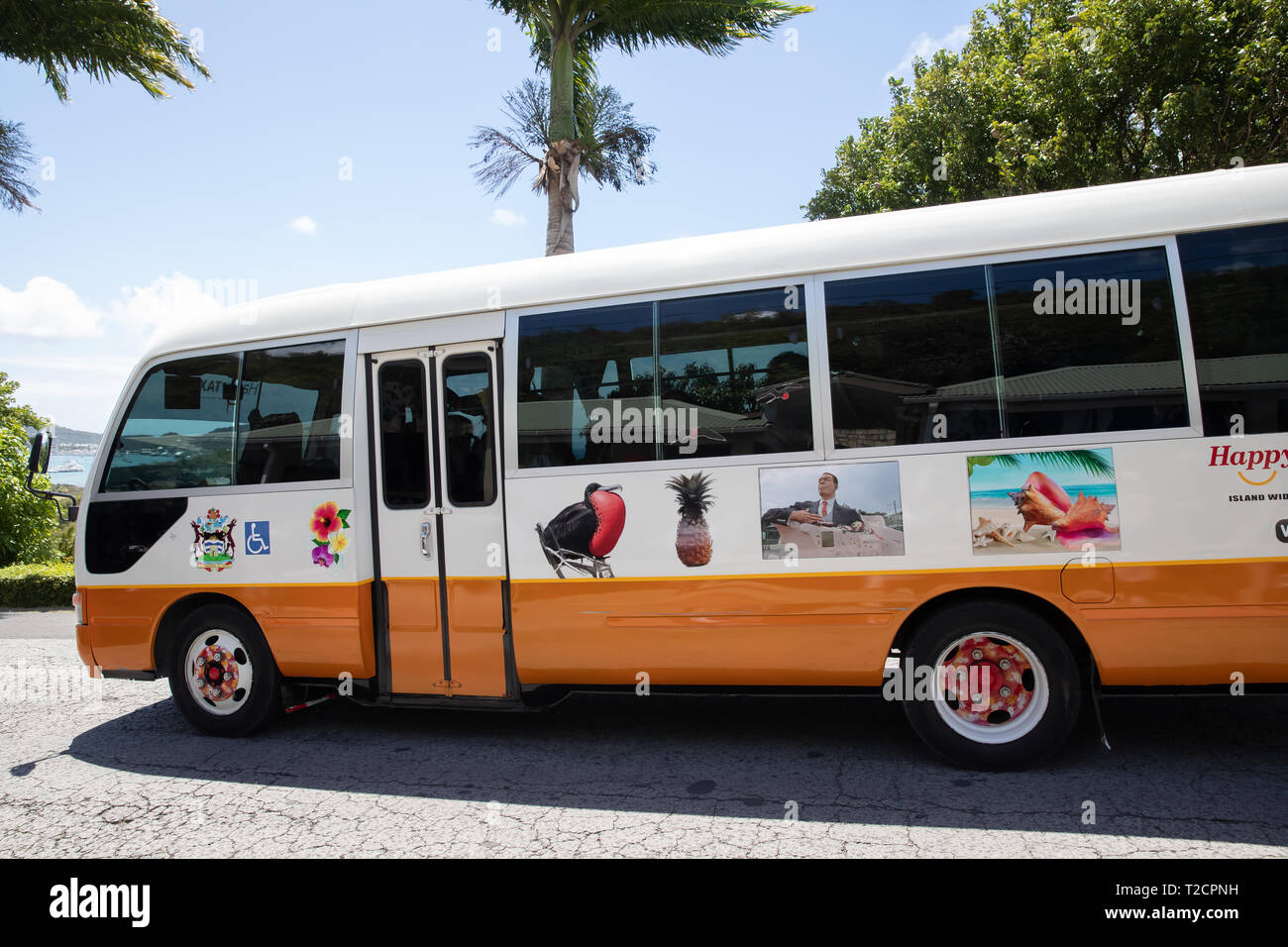 Guided tour bus in Antigua, The Caribbean Stock Photo - Alamy