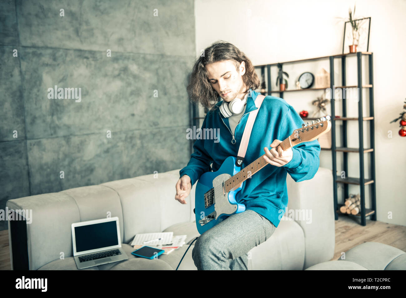 Creative young musician being involved in music repetition Stock Photo ...