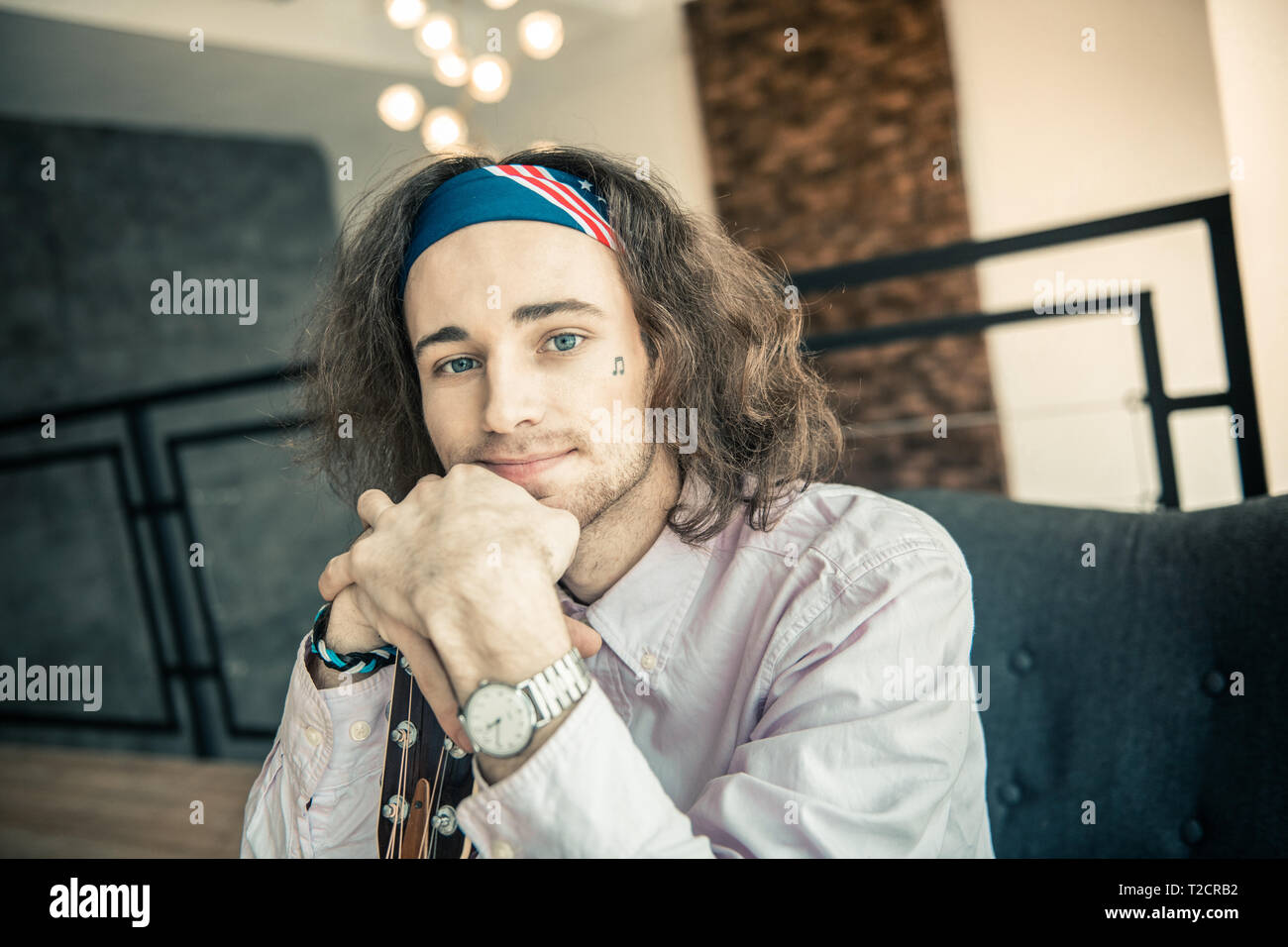 Smiling good-looking young artist with bright blue eyes Stock Photo - Alamy