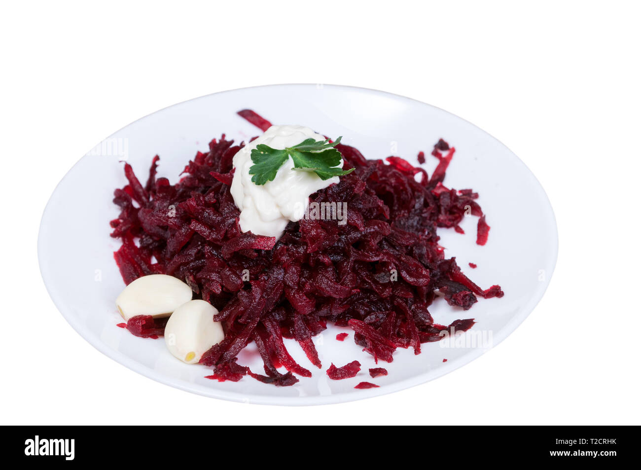 Grated beets with garlic in a plate isolated on white background Stock ...
