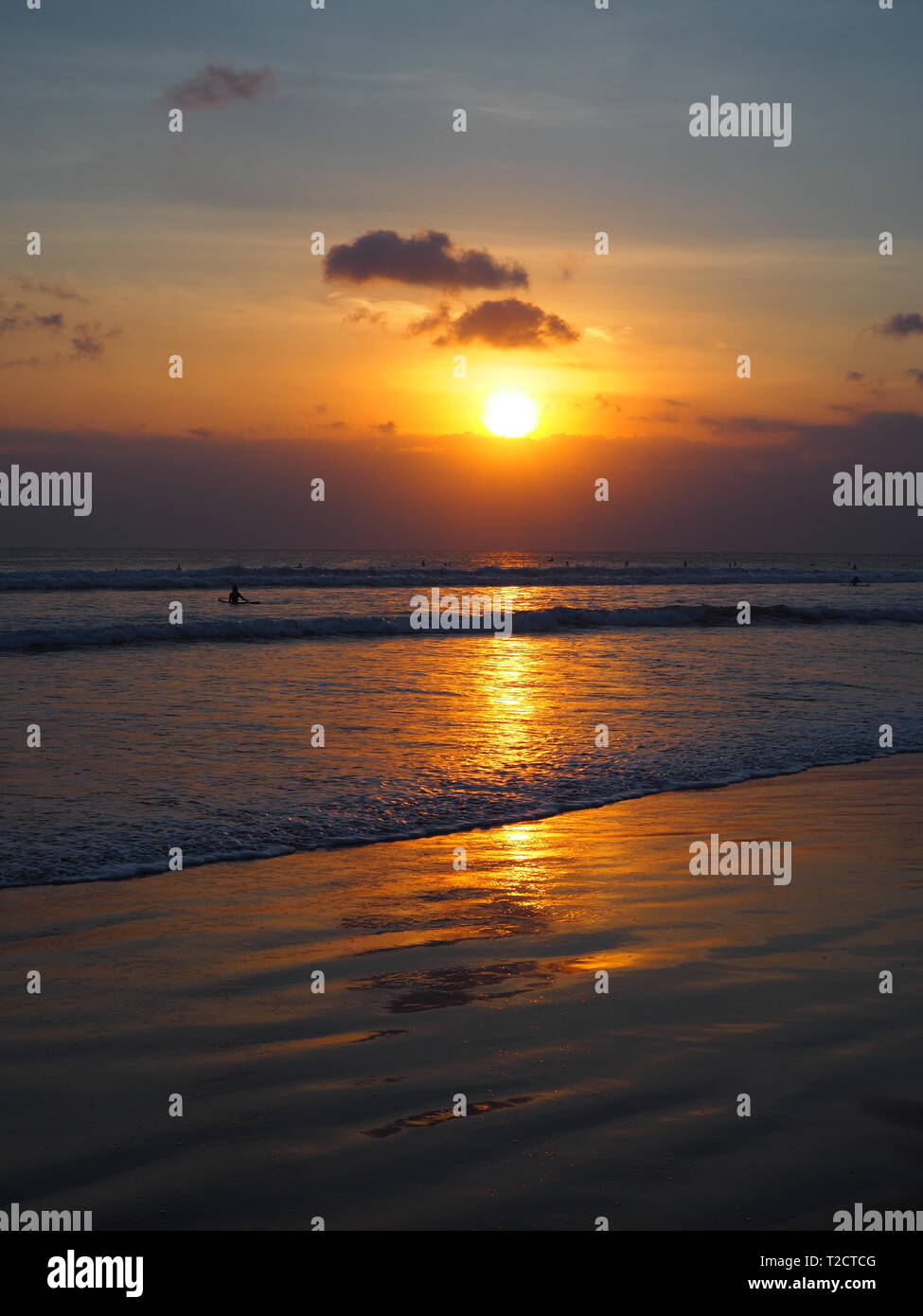 Surfing and sunset on Kuta Beach, Bali, Indonesia Stock Photo - Alamy