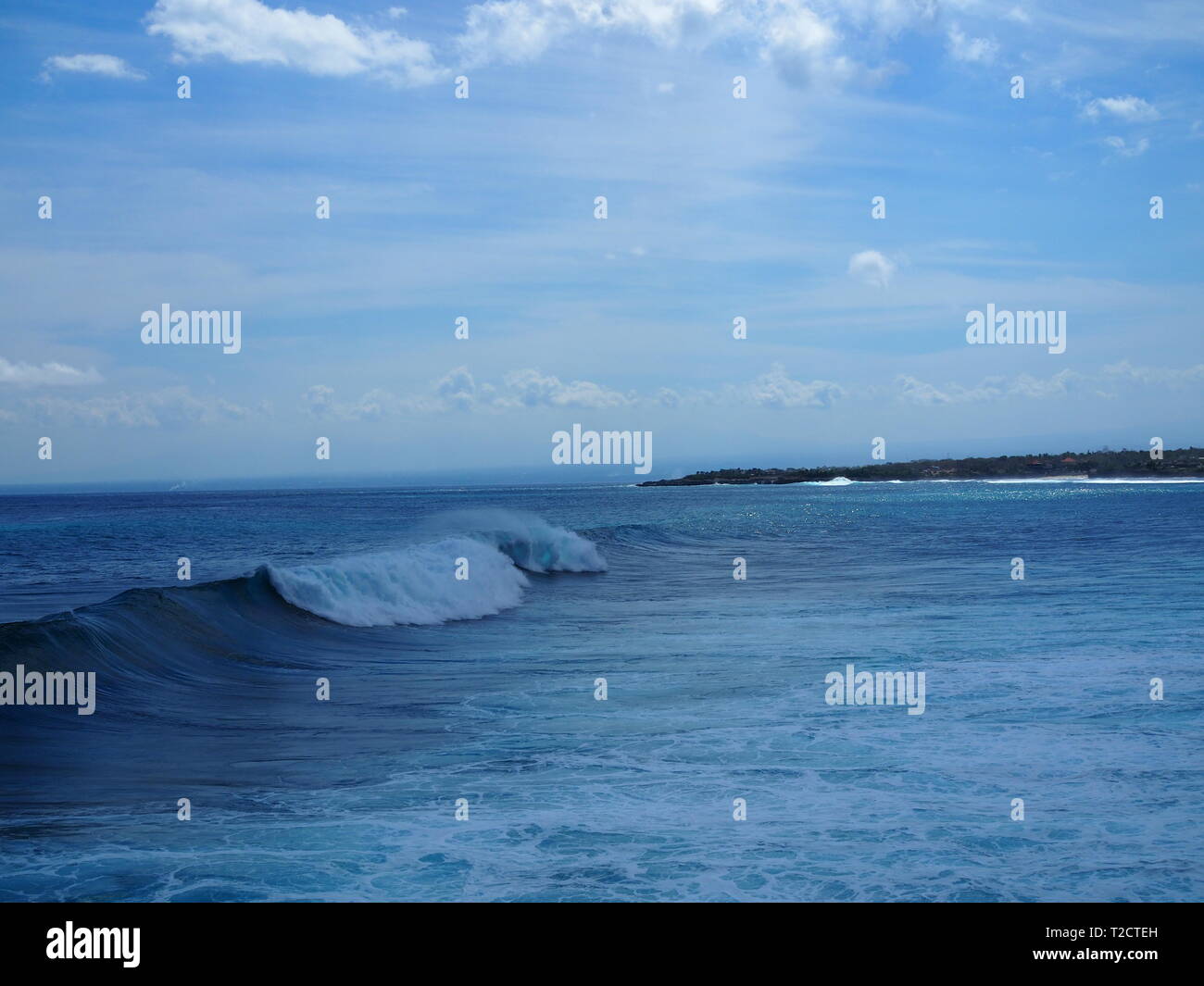 Surfing at Mahana Point, Ceningan Island, Nusa Penida, Indonesia Stock ...