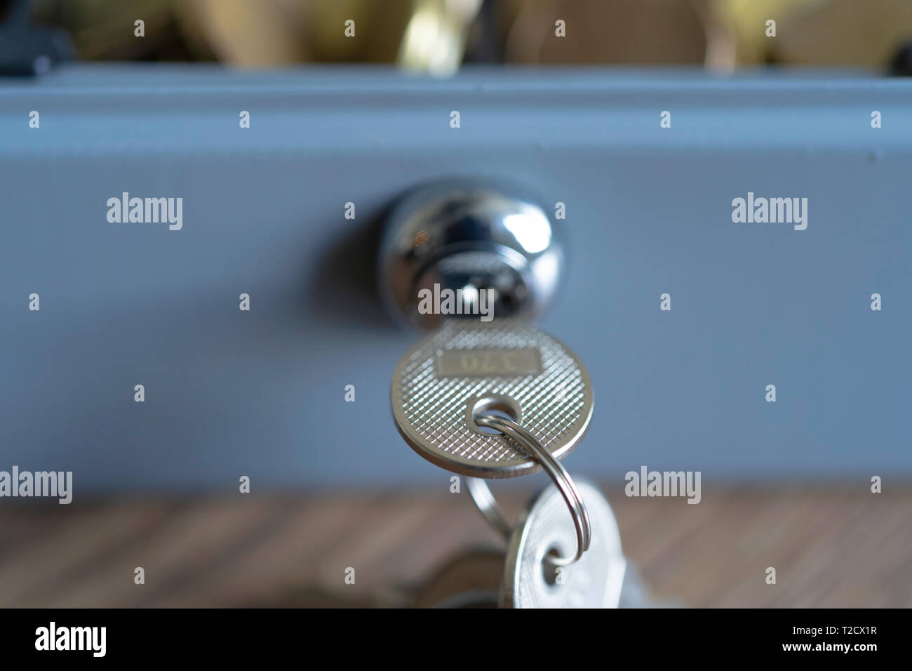 Cashbox lock with keys and full of Coins Stock Photo - Alamy