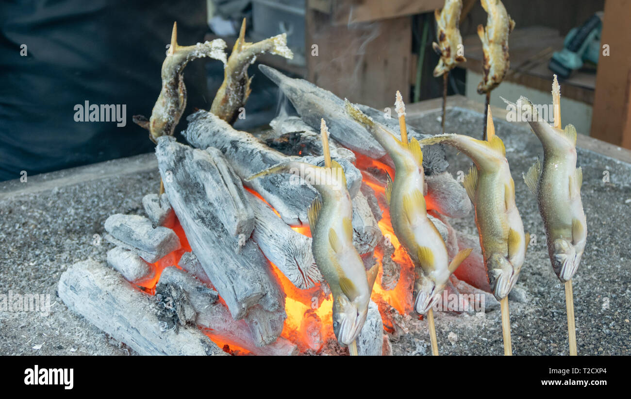 Grilled iwana or yamame fish, grilled next to coals on sticks, a famous ...