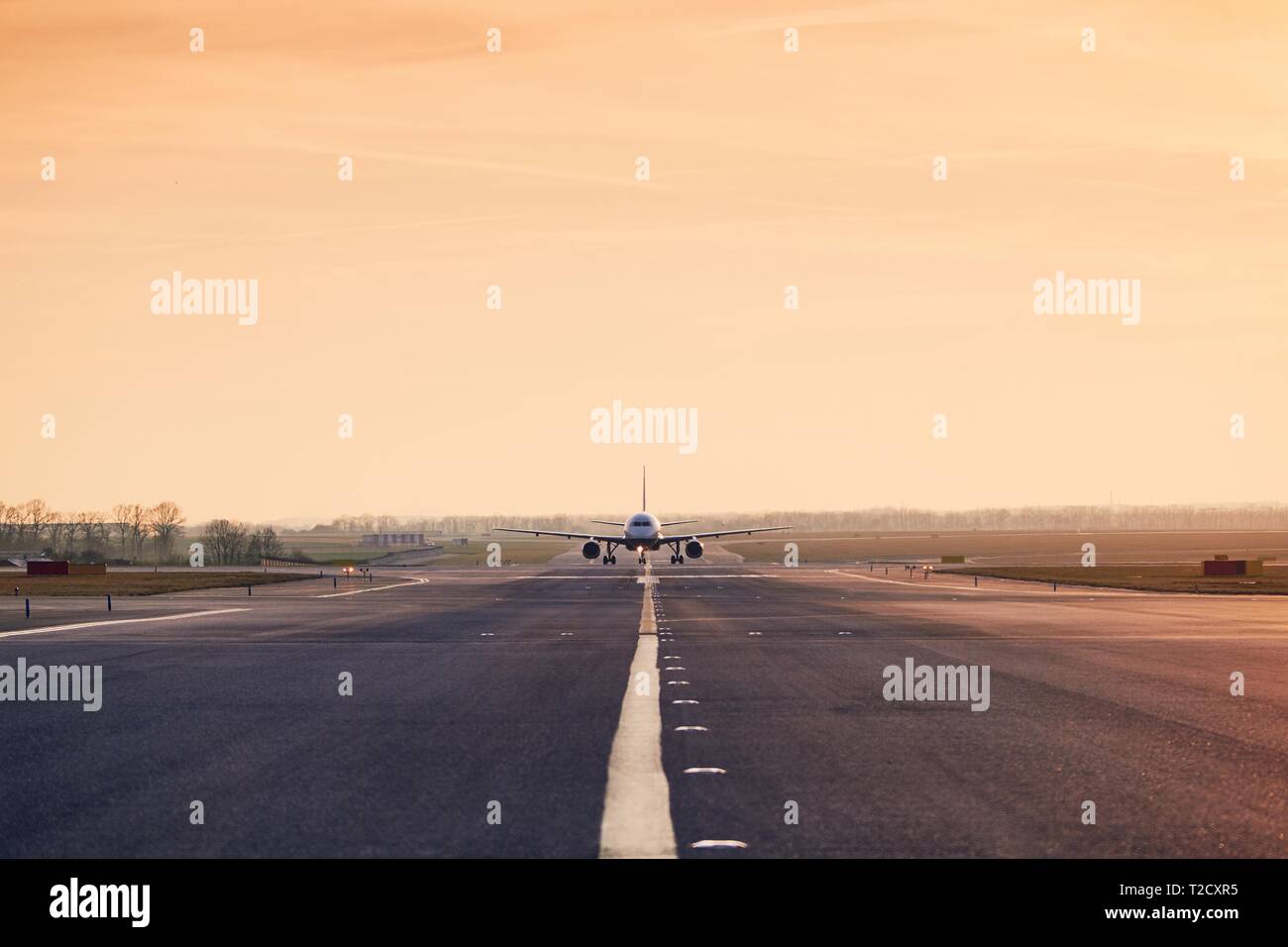 Front view of airplane on taxiway after landing. Traffic at airpot at ...