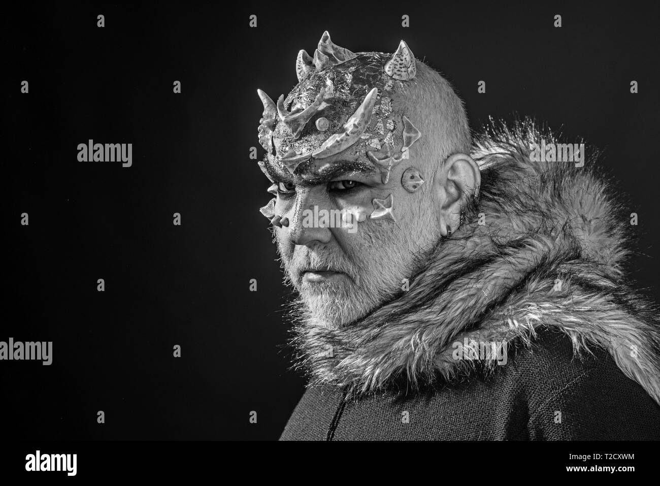 Alien, demon, sorcerer makeup. Demon on black background, copy space ...