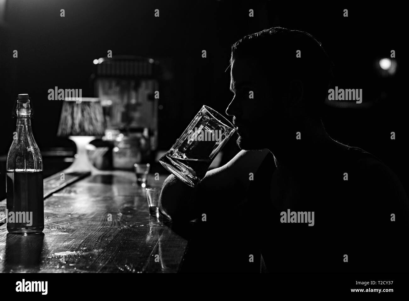 Enjoying cold drink. Man drinker in pub. Handsome man drink beer at bar ...