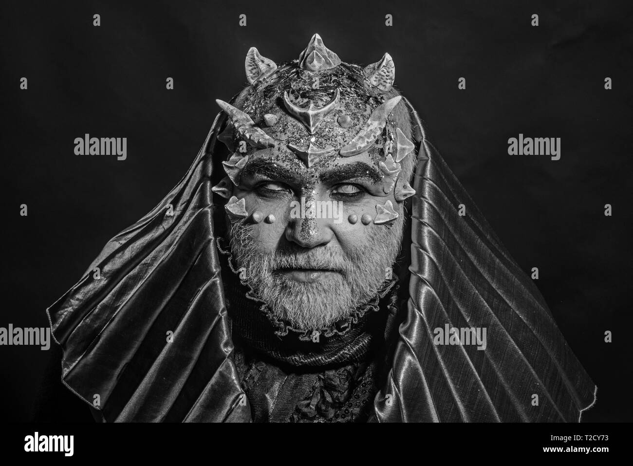 Senior man with white beard dressed like monster. Fantasy concept. Man ...