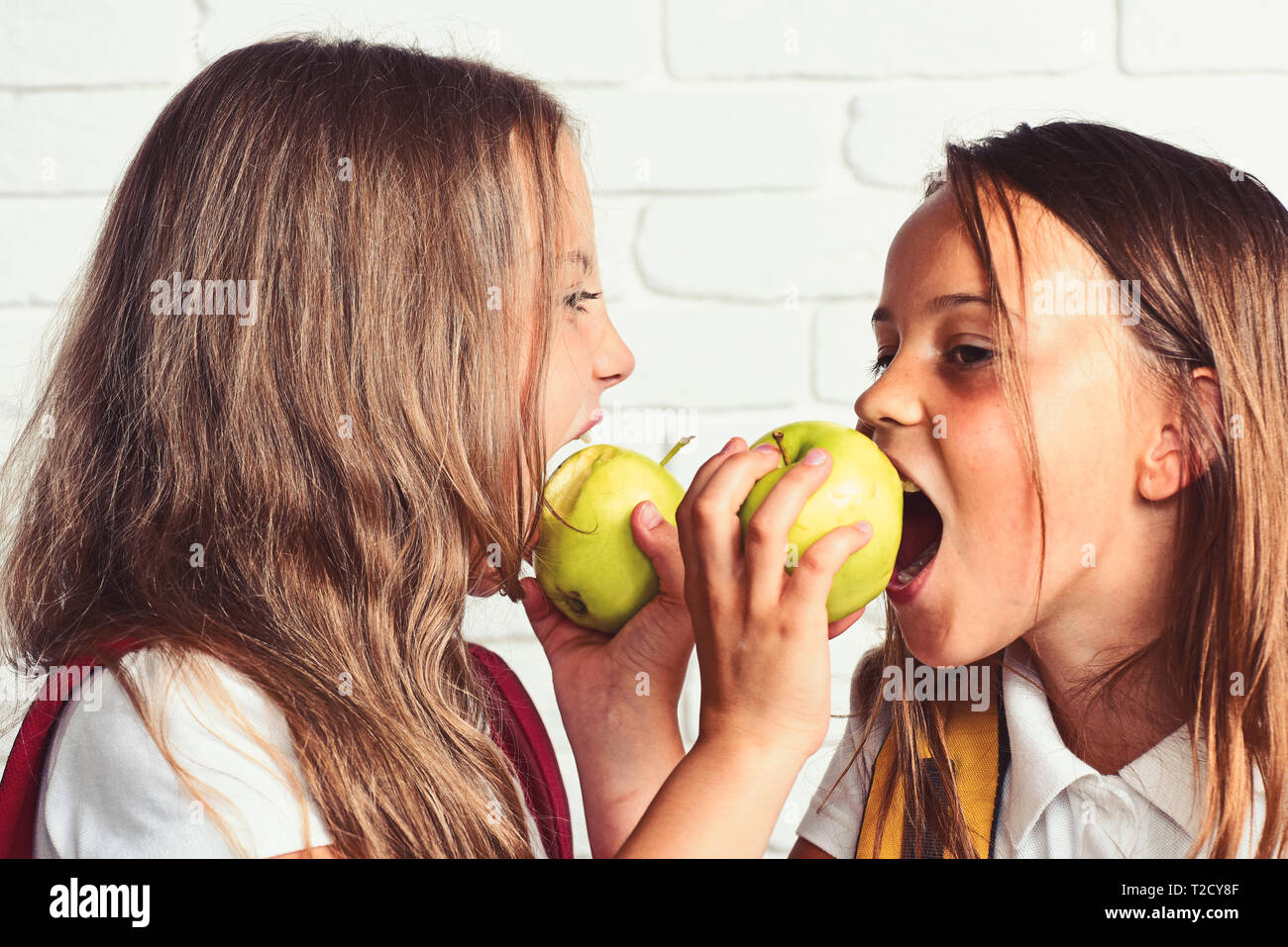 healthy food and dieting. little kids eat fresh apple Stock Photo - Alamy
