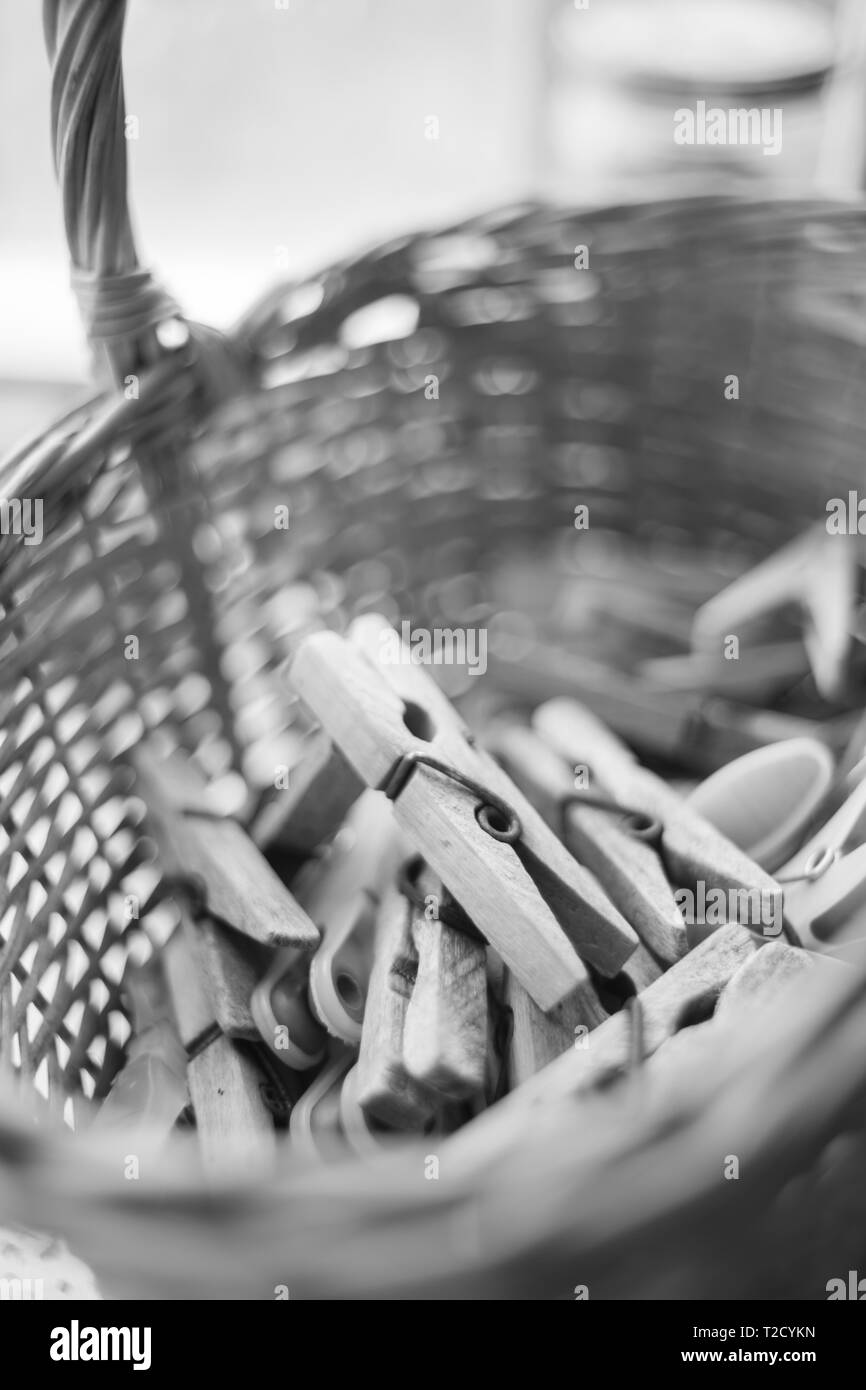 wooden clothespins in a wicker basket Stock Photo - Alamy