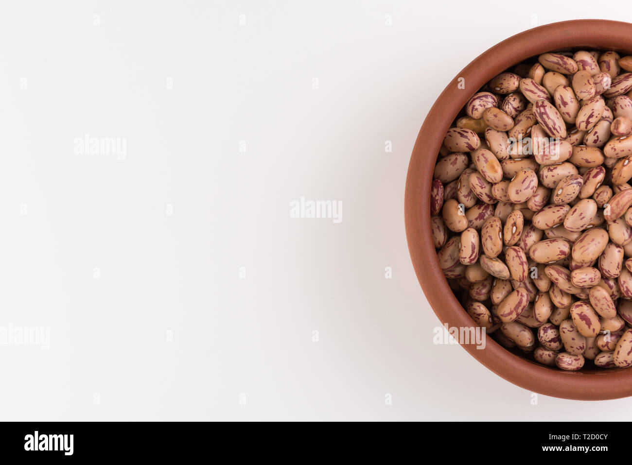 A plate of beans on white background Stock Photo - Alamy
