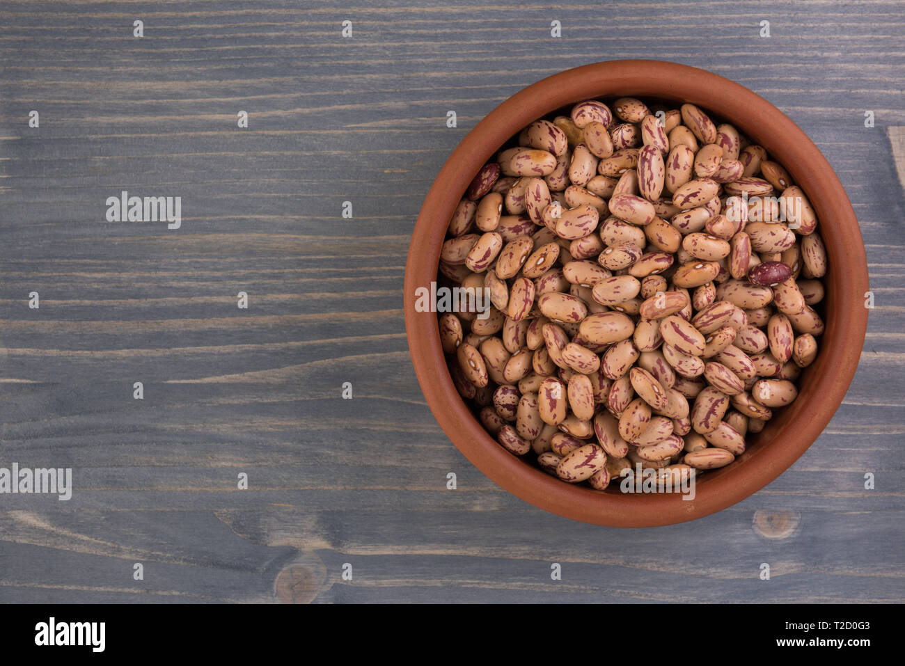A plate of beans on wooden table background Stock Photo - Alamy