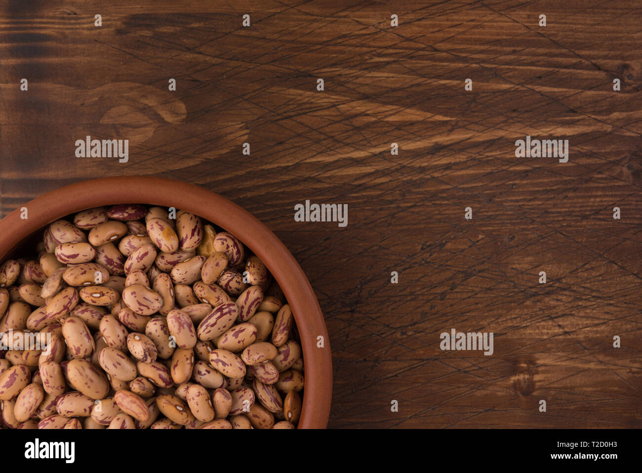 A plate of beans on wooden table background Stock Photo - Alamy