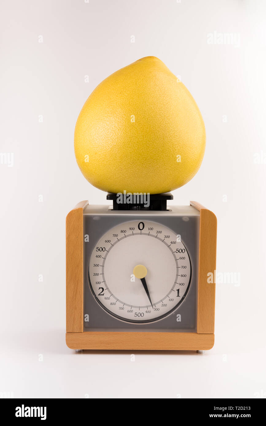 vintage wooden kitchen scales isolated on white background with yellow ...
