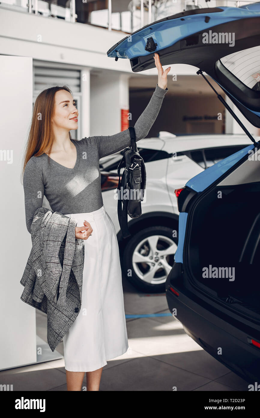 Young lady car salon hi-res stock photography and images - Alamy