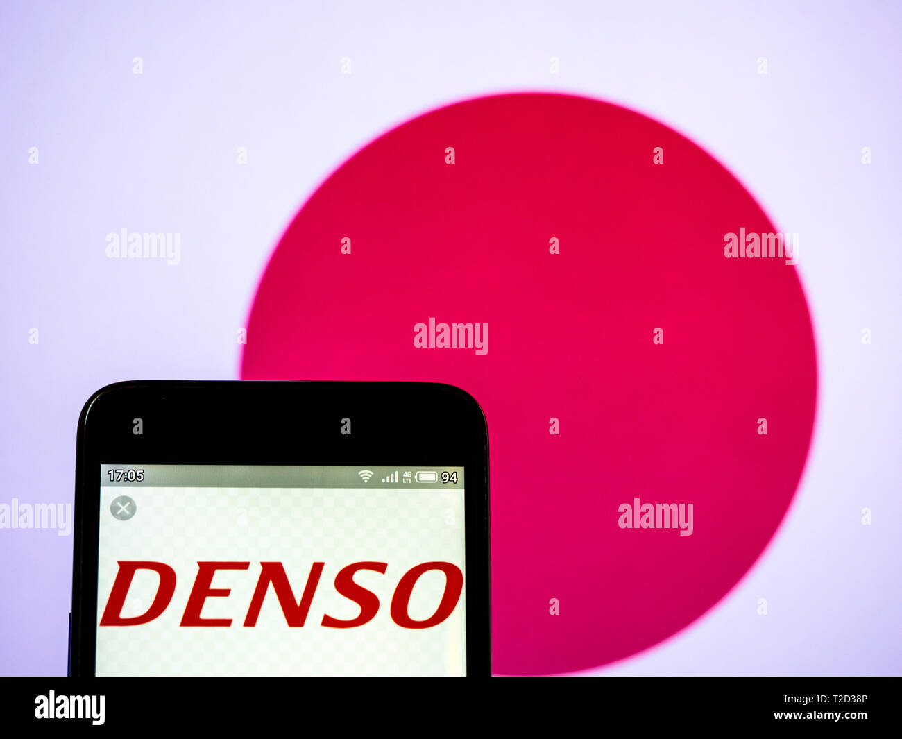 In this photo illustration a Denso Corporation logo seen displayed on a ...