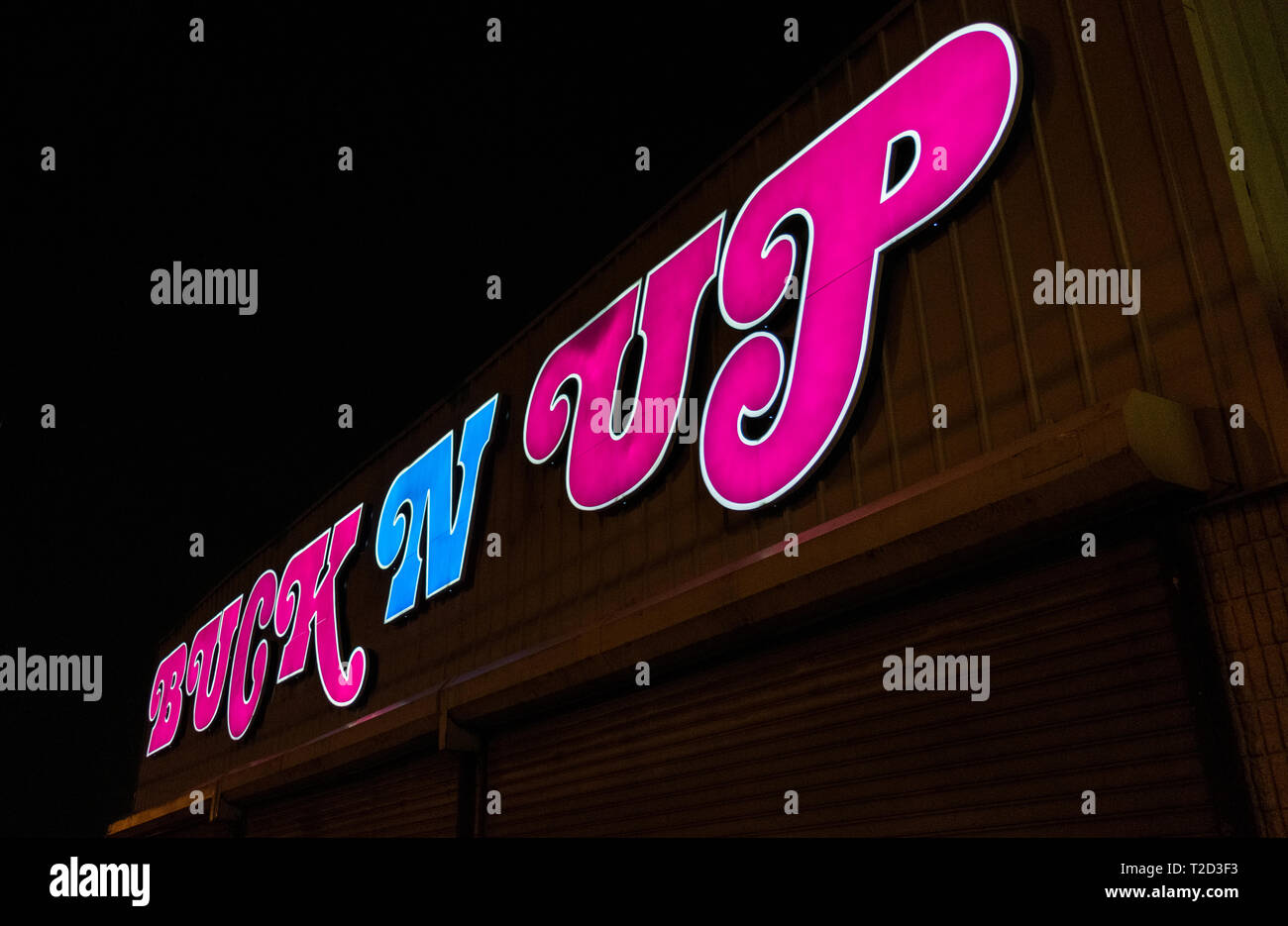 Buck N Up dollar-store, closed storefront and business sign during ...