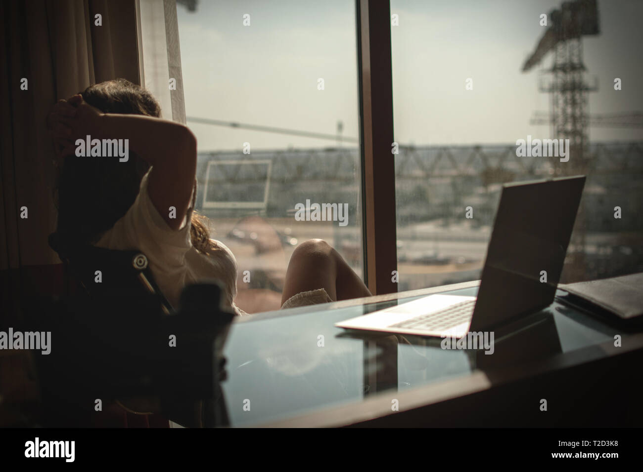 Happy young designer or architect sitting in front of computer monitor ...