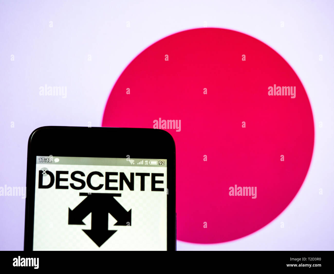 In this photo illustration a Descente Ltd. logo seen displayed on a ...