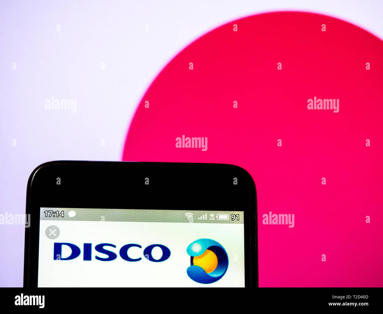 In this photo illustration a DISCO Corporation logo seen displayed on a ...