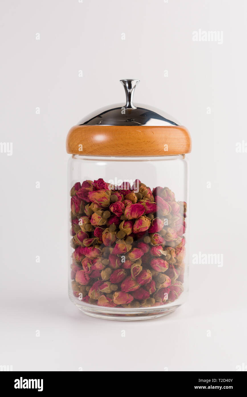 tea rose buds in the transparent jar isolated on white background Stock ...