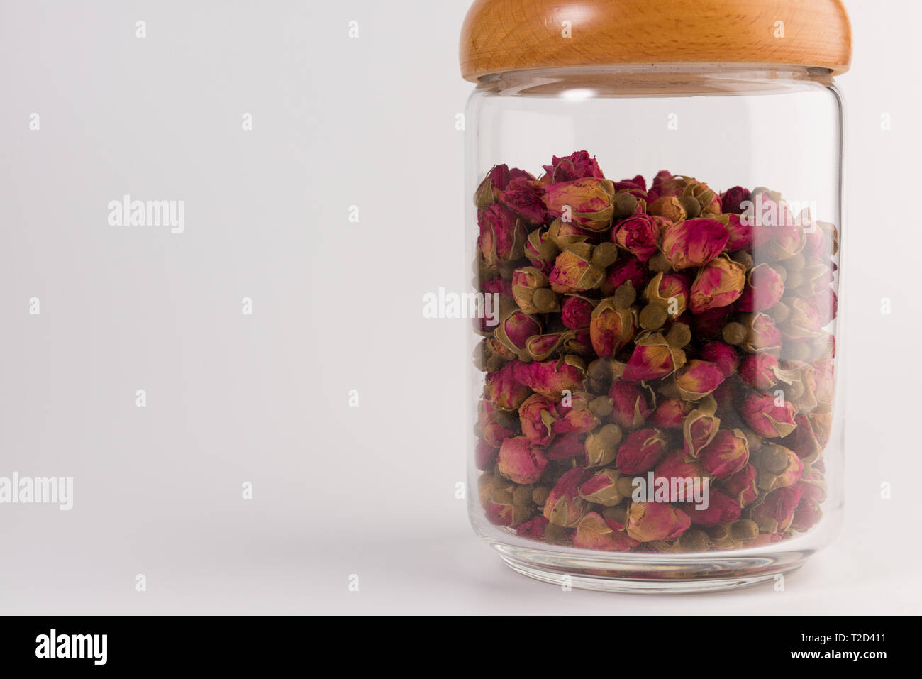 tea rose buds in the transparent jar isolated on white background Stock ...