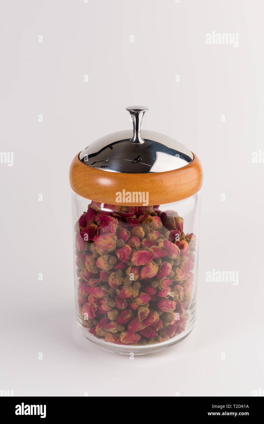 tea rose buds in the transparent jar isolated on white background Stock ...