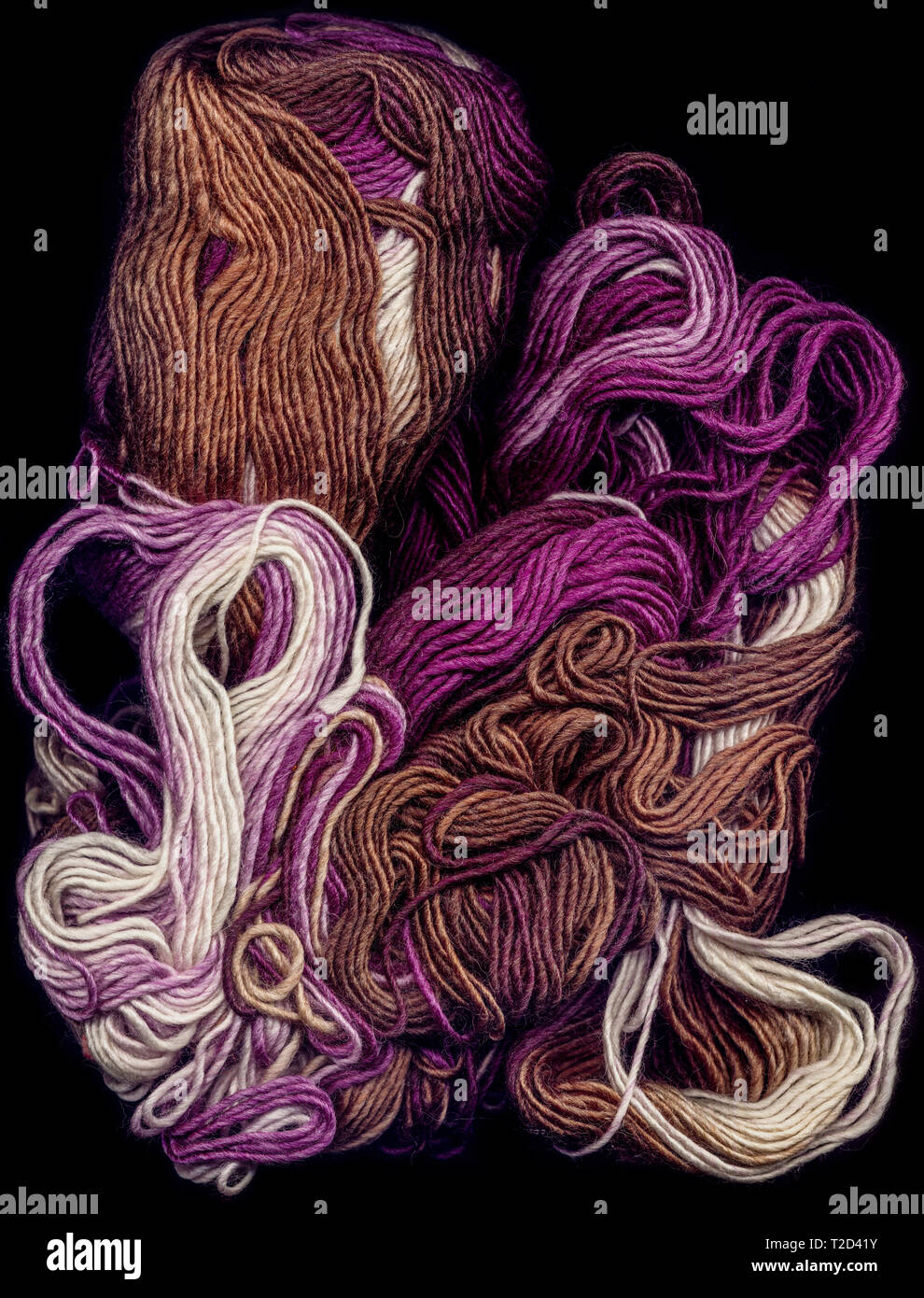 Multi-colored Wool natural threads on a black background Stock Photo ...