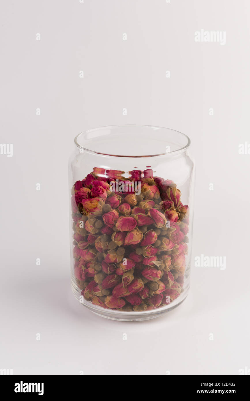 tea rose buds in the transparent jar isolated on white background Stock ...