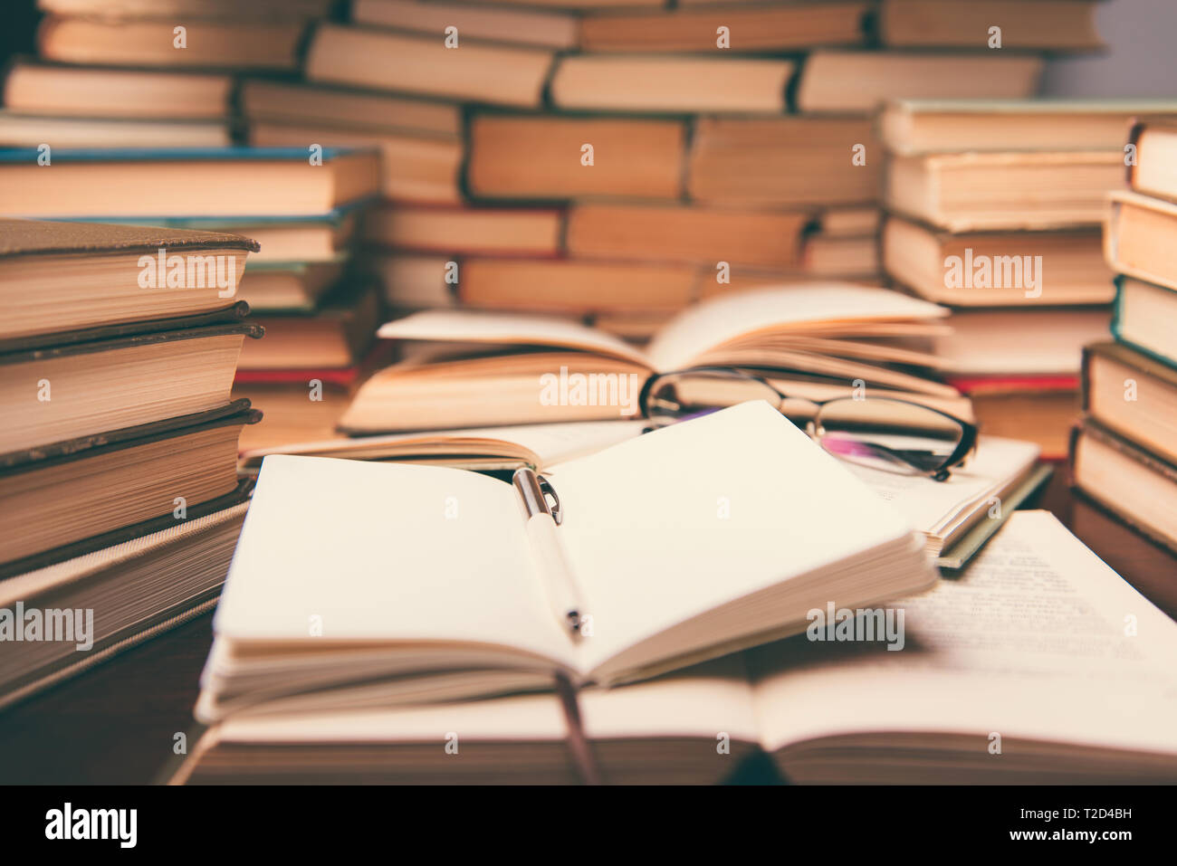 Education learning concept with open book and notebook on the table ...