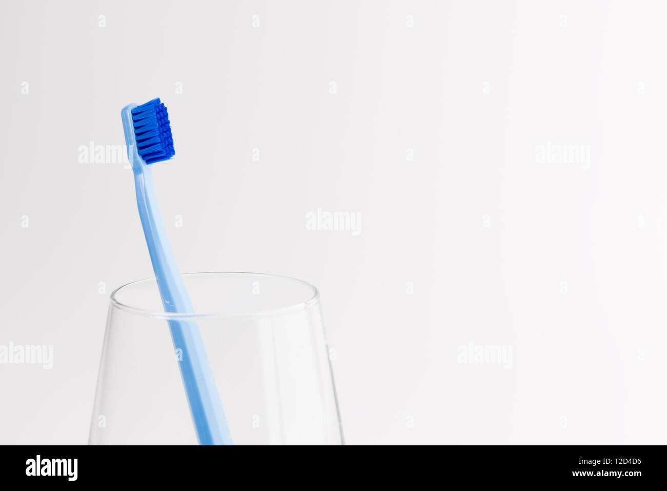 Cup with toothbrush isolated on white background. Dental care Stock ...