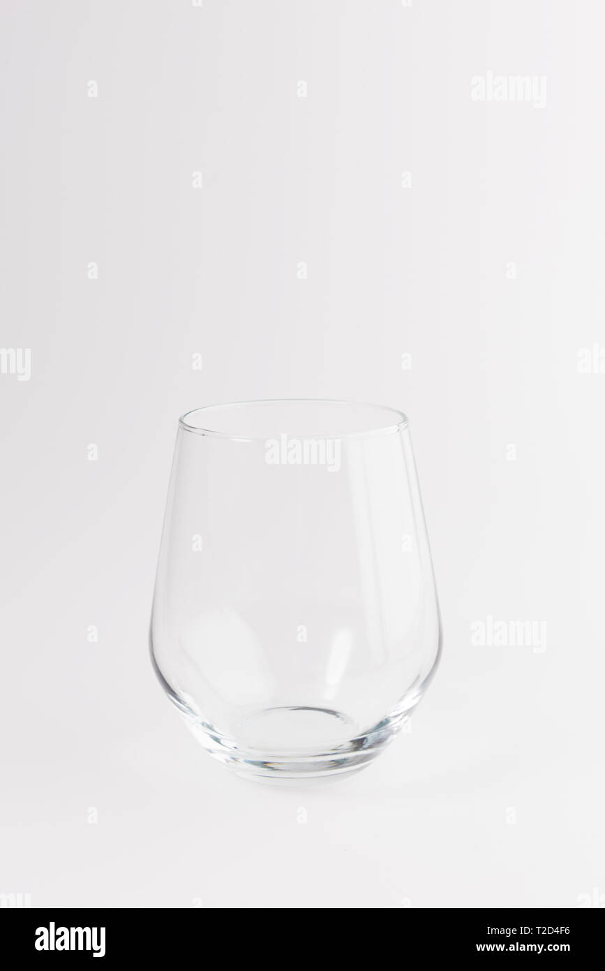Empty curve shape glass isolated on white background Stock Photo - Alamy