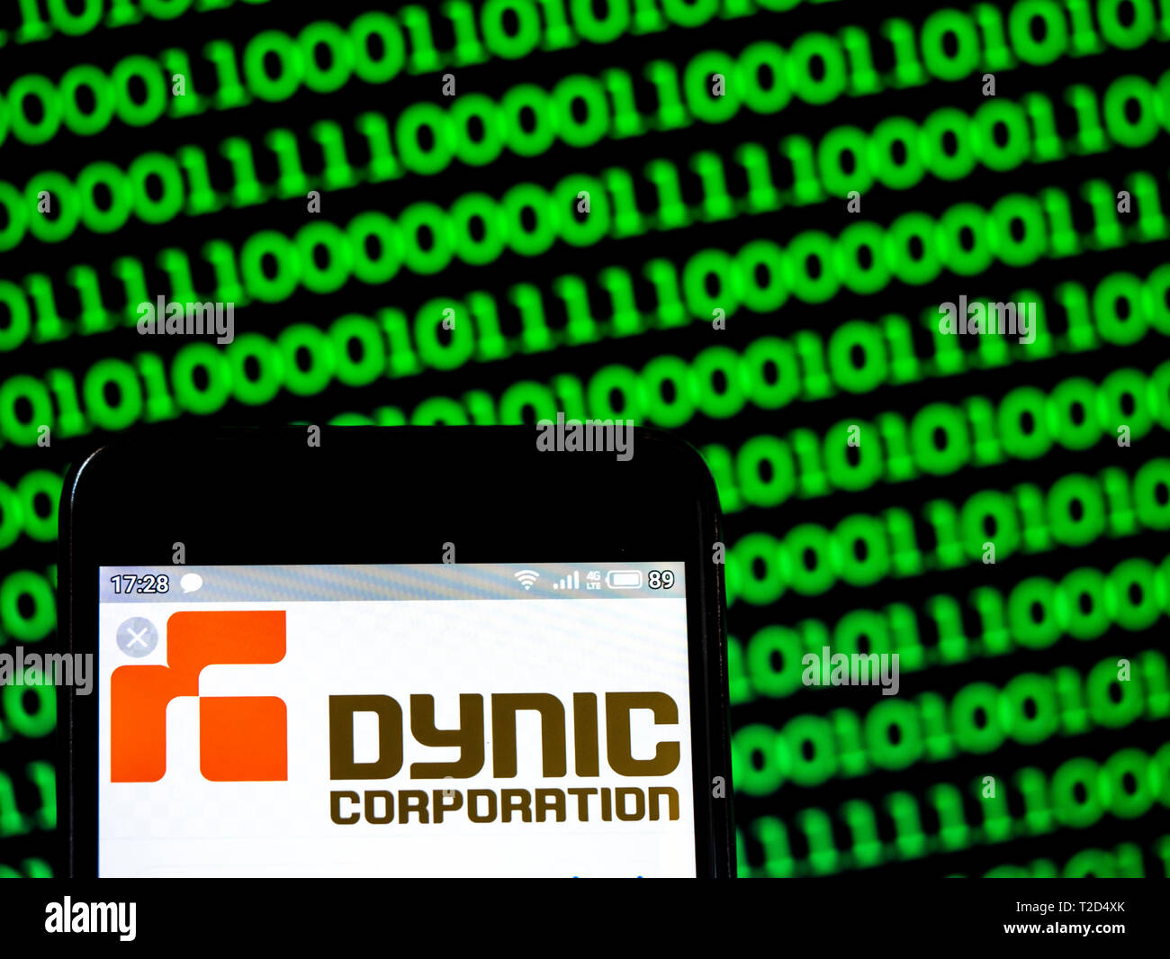 In this photo illustration a Dynic Corporation logo seen displayed on a ...