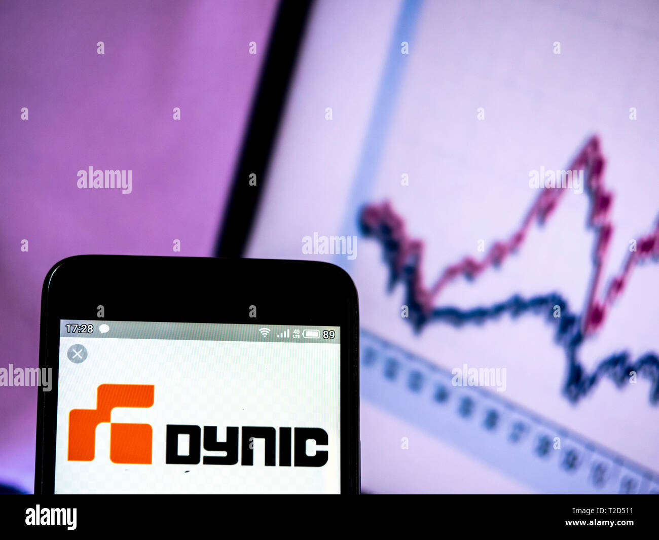 In this photo illustration a Dynic Corporation logo seen displayed on a ...