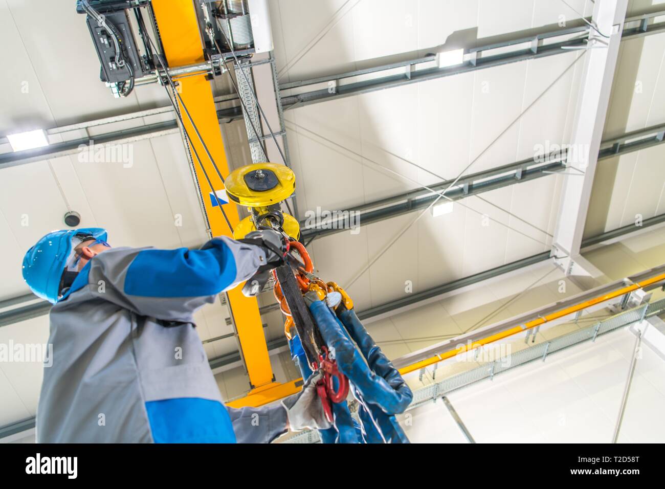 Ceiling Mounted Crane Lift Caucasian Operator. Industrial Technologies ...