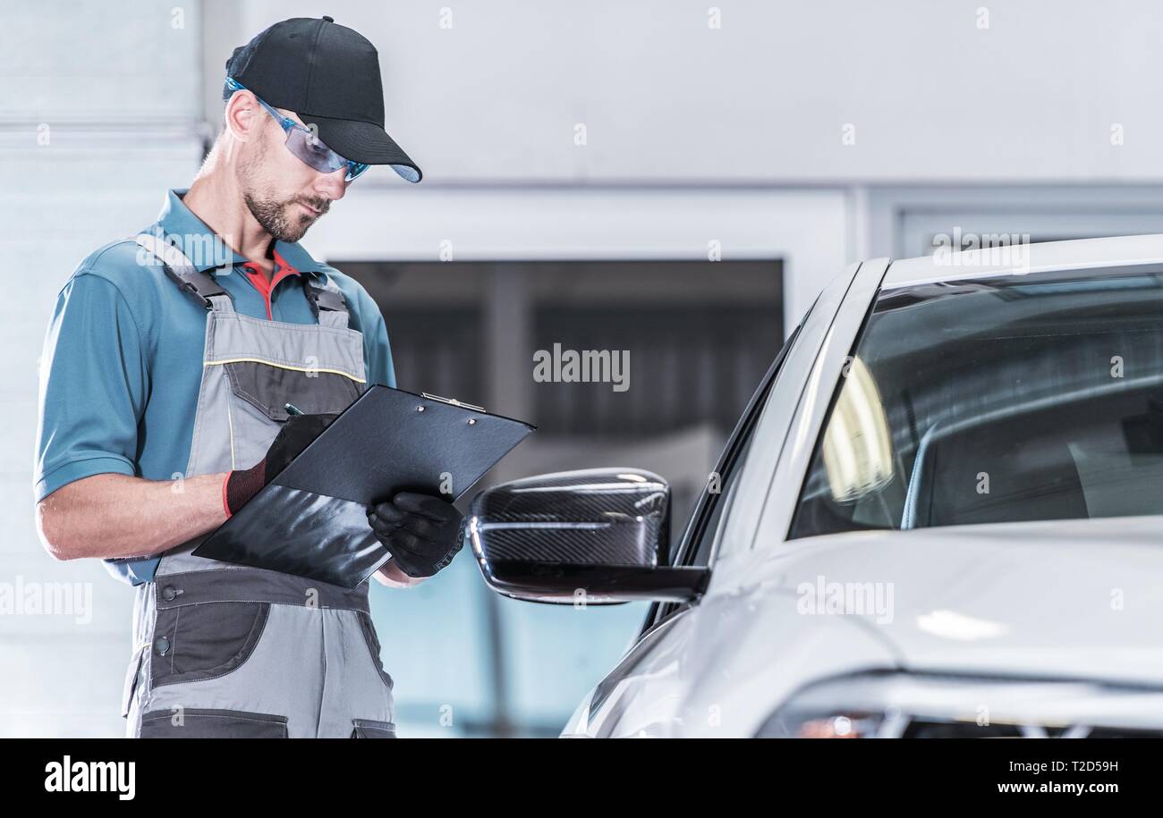 Certified Auto Service Worker Making Warranty Documentation. Vehicle ...