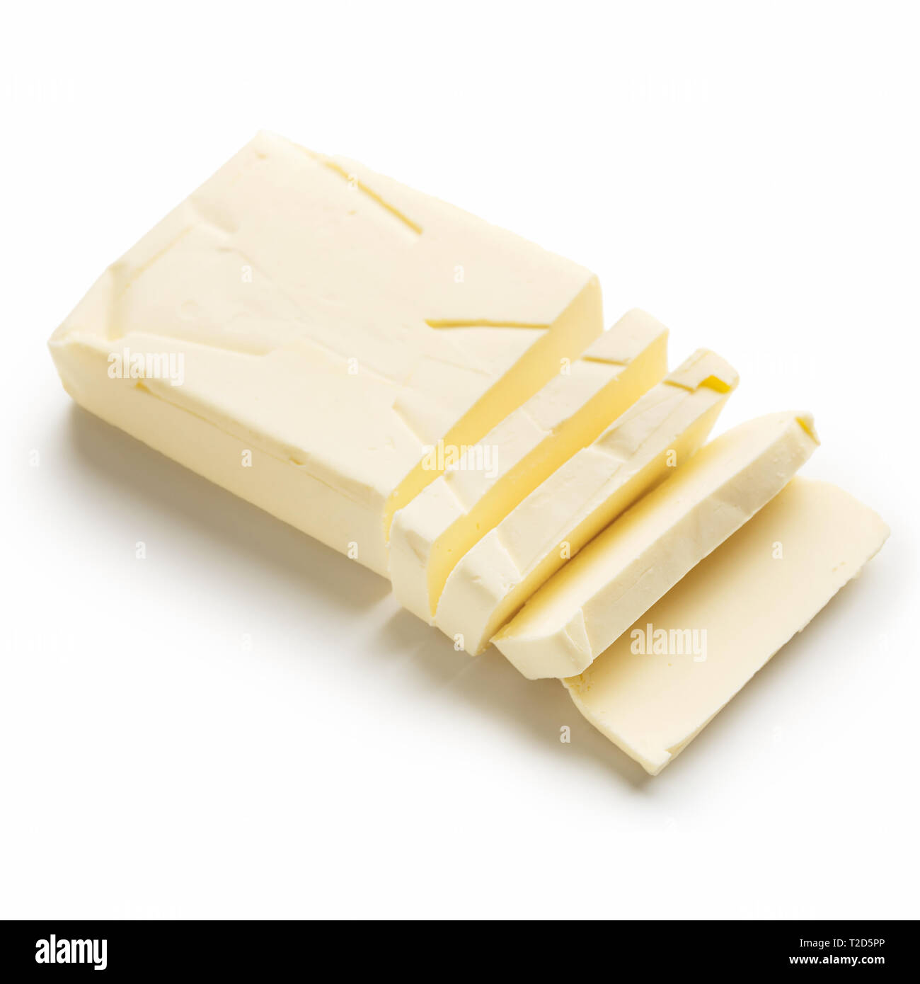 Piece of butter sliced on white background Stock Photo - Alamy
