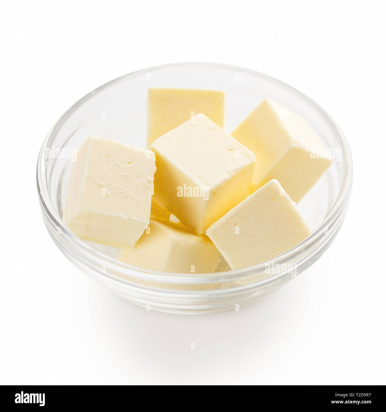 Cubes of butter in glass bowl on white background Stock Photo - Alamy