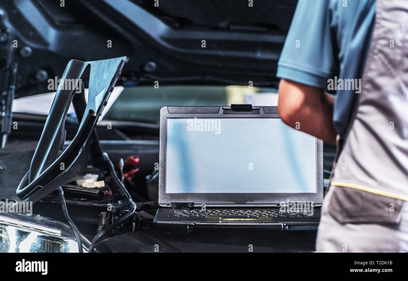 Connecting Car to Computer by Professional Automotive Technician Inside ...