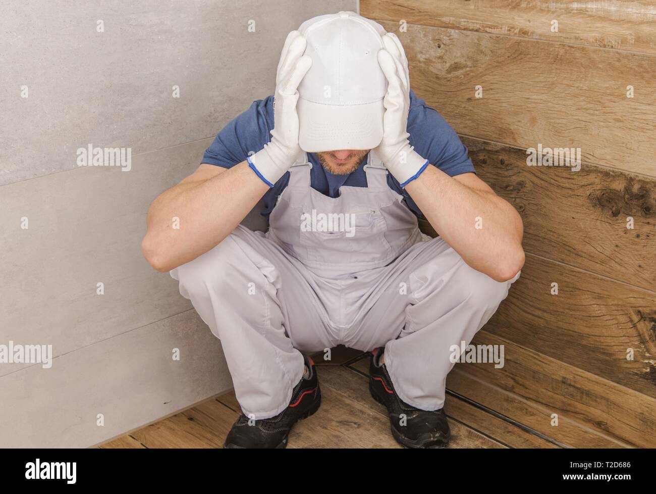 Devastated Home Finishing Worker in a Bathroom Corner. Interior ...