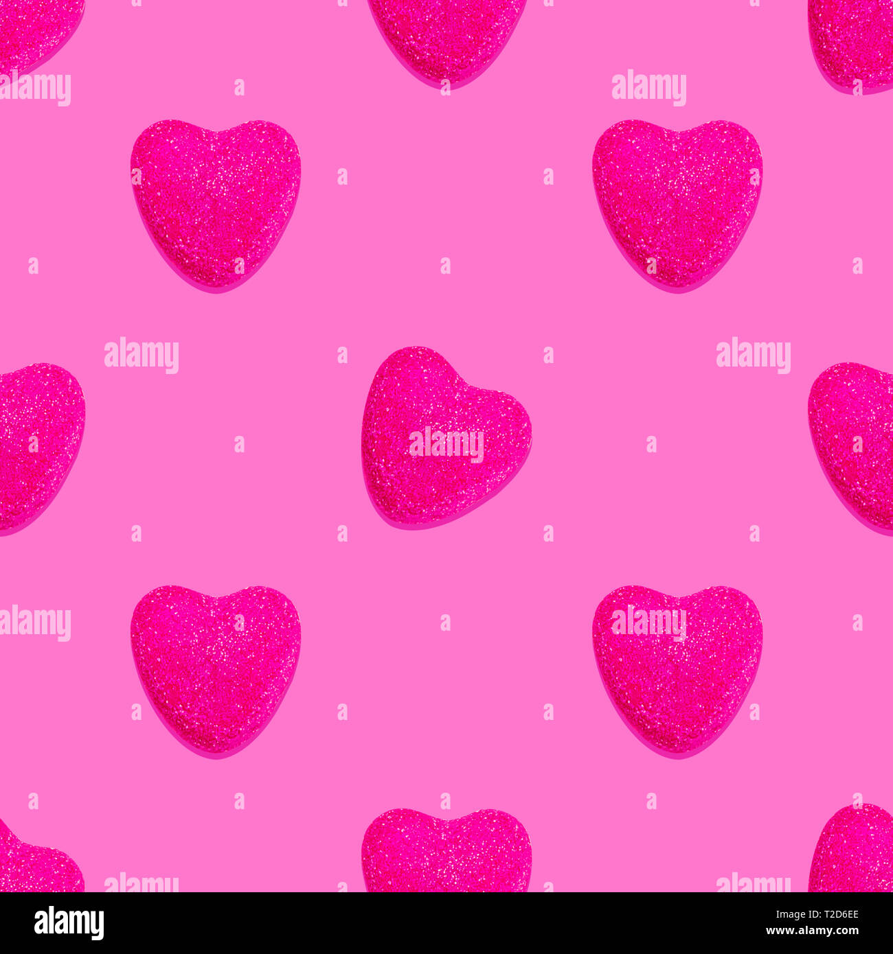 Pink seamless pattern with heart-shaped chewing candy Stock Photo - Alamy