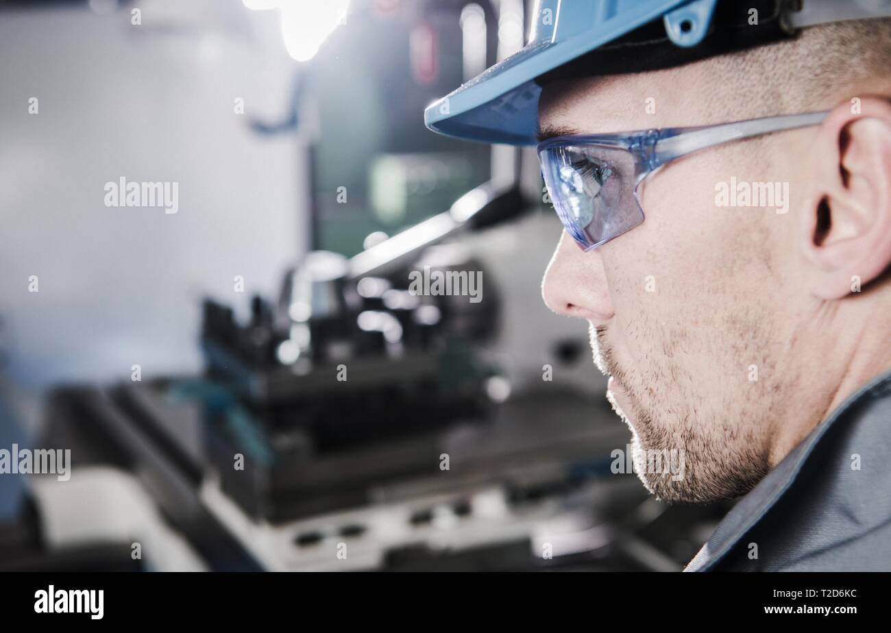Caucasian Industrial Worker Wearing Safety Glasses and Hard Hat ...
