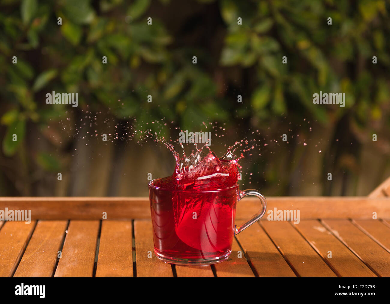 Tea splash in the cup. Splash outdoor. Splash in the cup Stock Photo ...