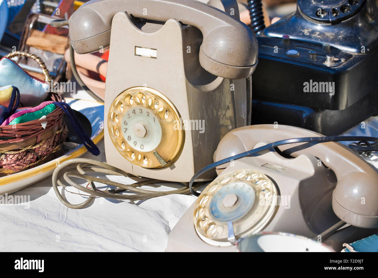 Old colored plastic analog phone in a flea market Stock Photo - Alamy