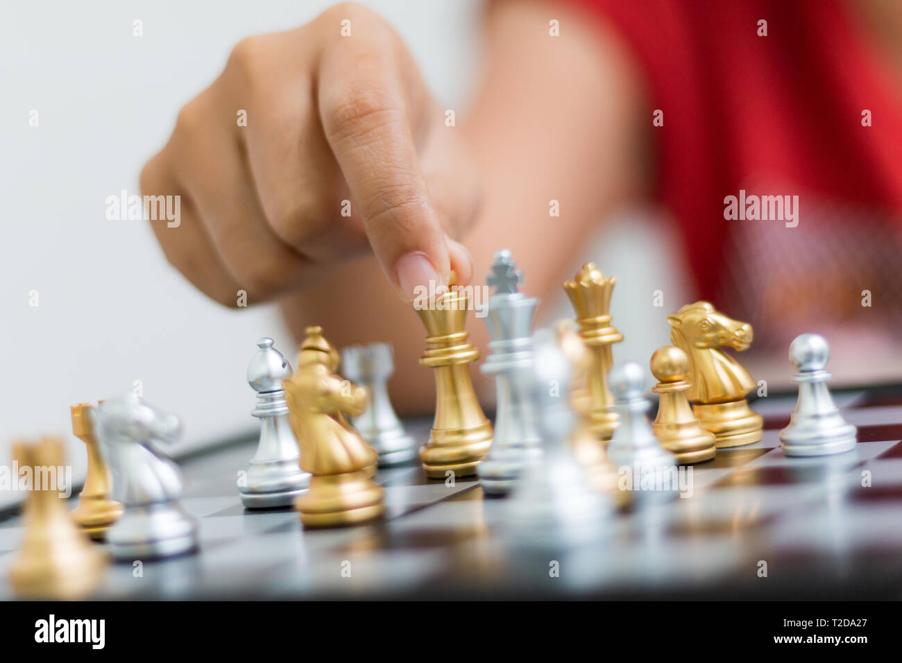 Hand of woman playing chess for business tactic and planning metaphor ...