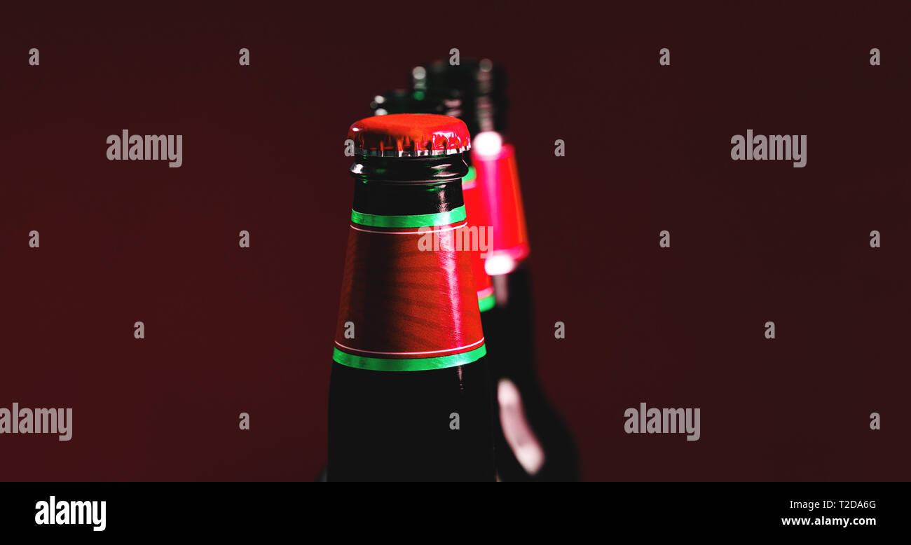 Fancy brown bottle of soft drink. Beer bottles with red cap and ...