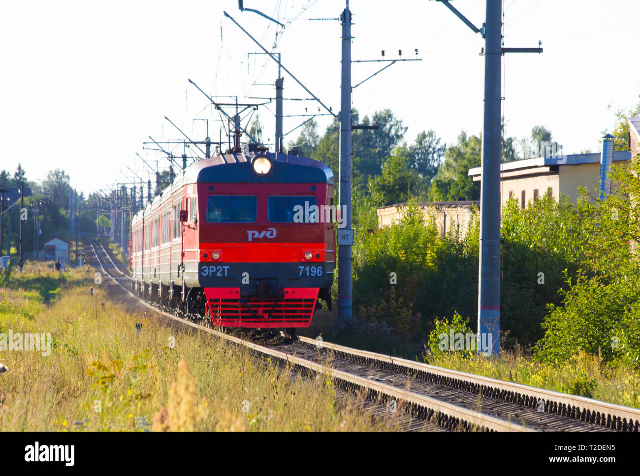 The train is on the rails in the evening. Russian railway. Electric ...