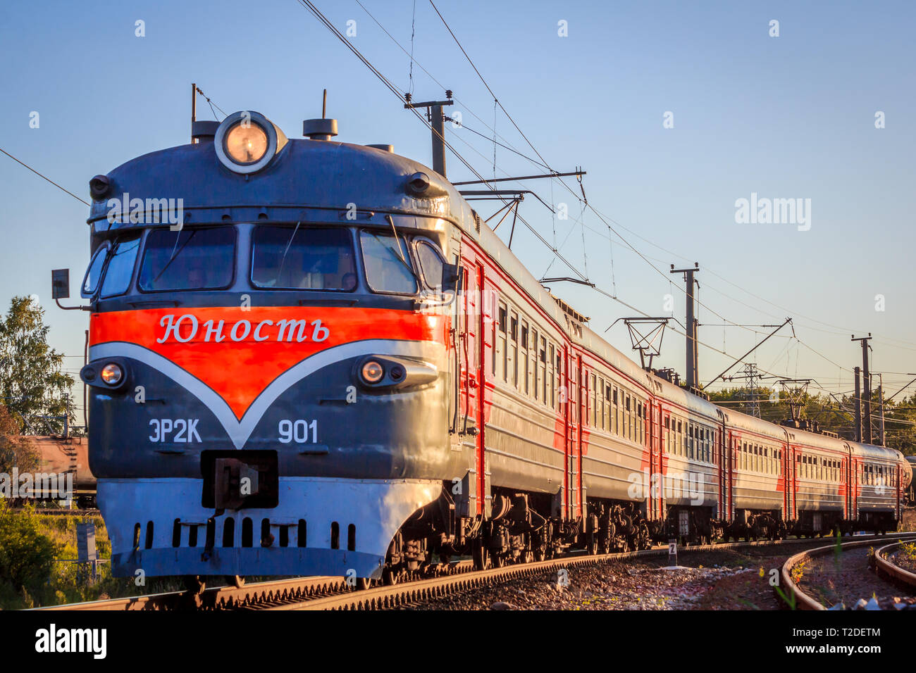 The train is on the rails in the evening. Russian railway. Electric ...