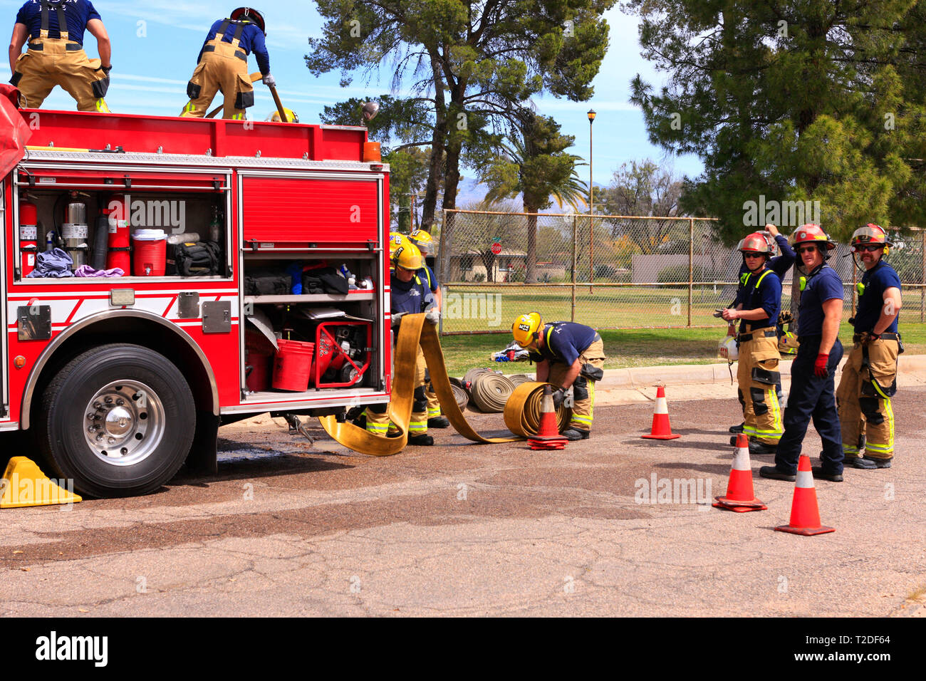 Firemen of the Tucson Fire Department finish up an emergency exercise ...