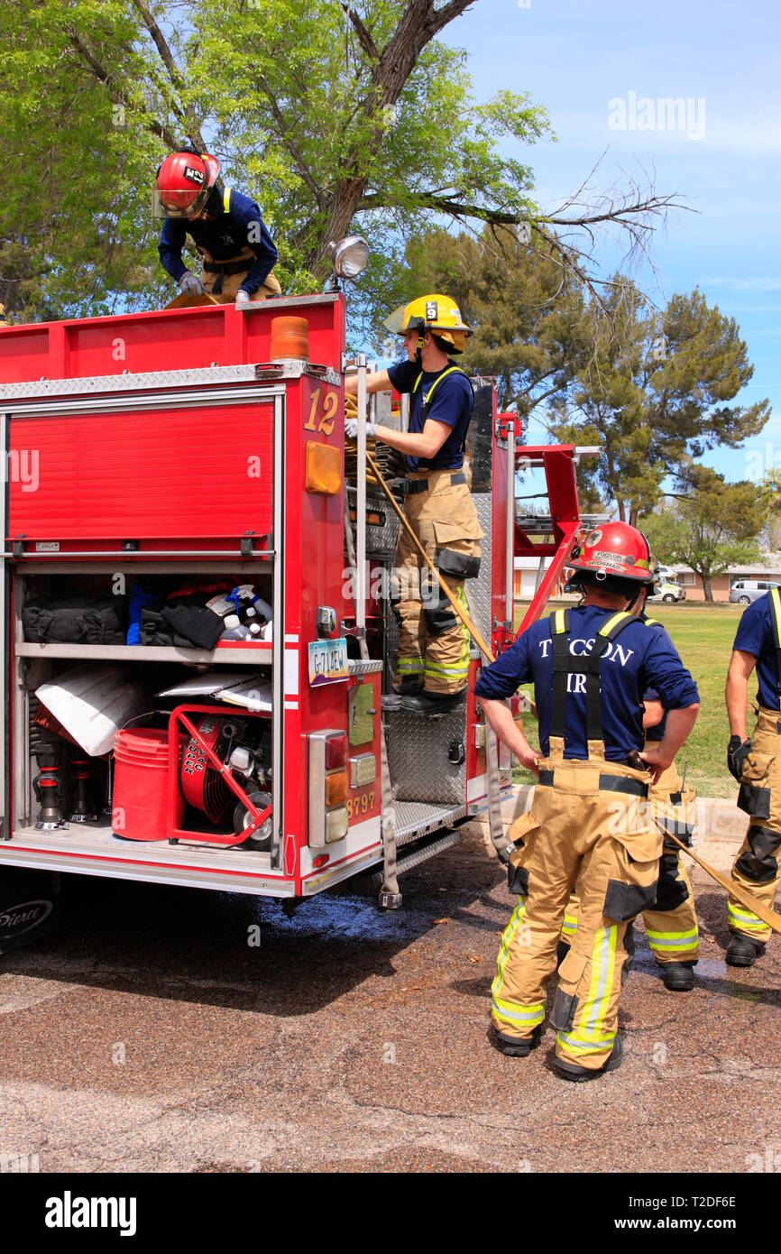 Firemen of the Tucson Fire Department finish up an emergency exercise ...